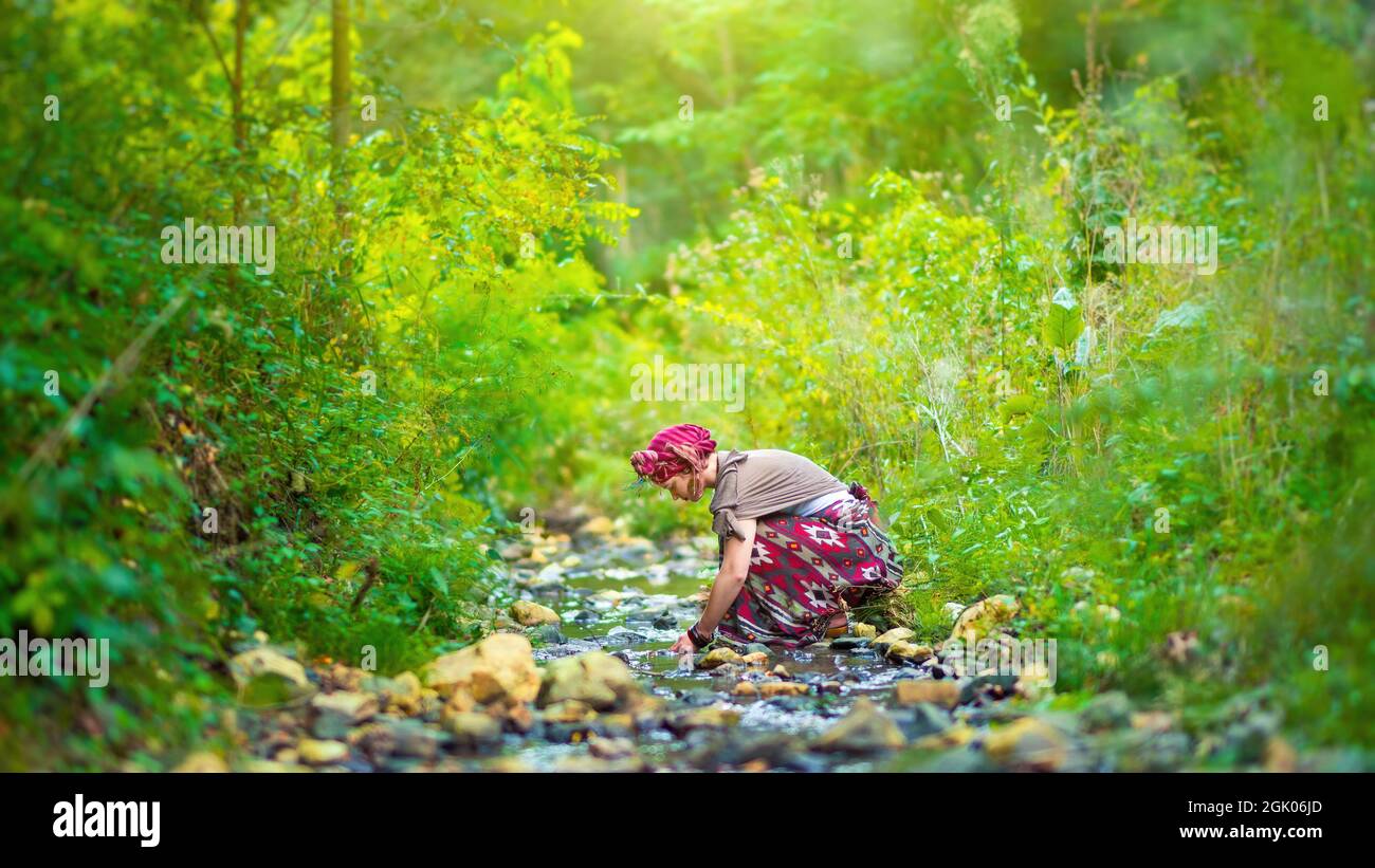 Washing clothes with river water hi-res stock photography and images ...