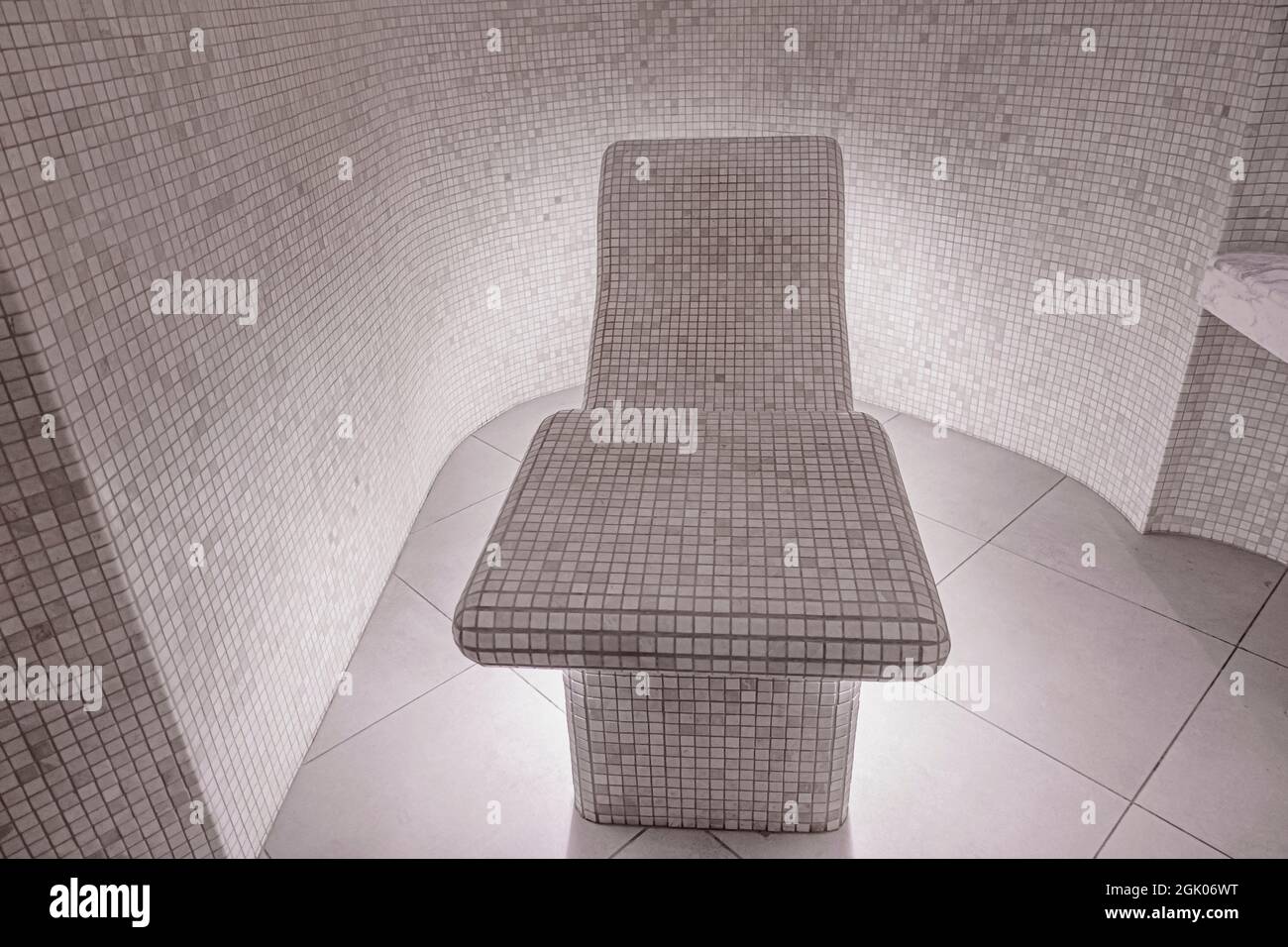 Hammam, traditional Turkish bath relaxation area with tiled seat and ...