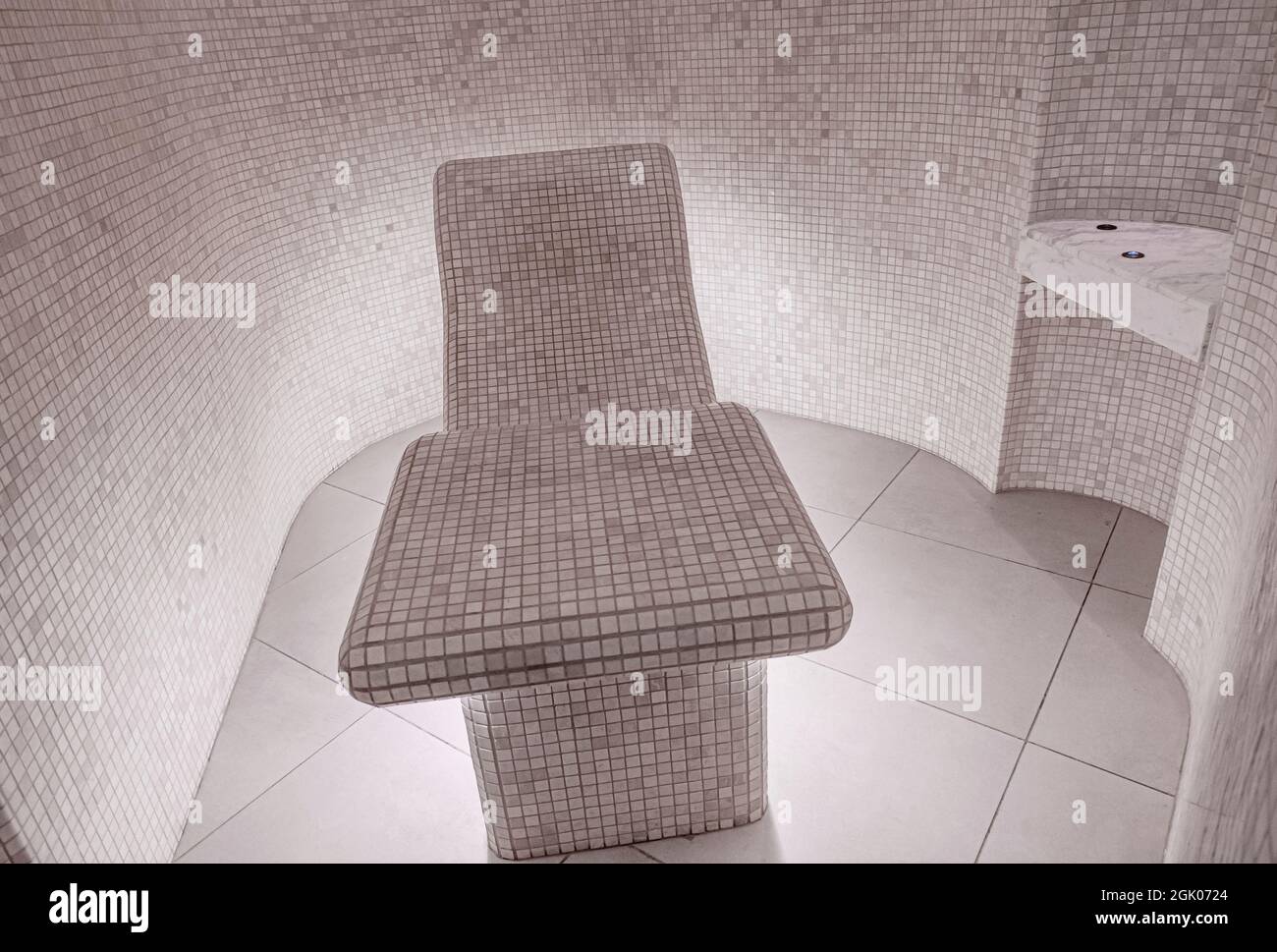 Hammam, traditional Turkish bath relaxation area with tiled seat and ...