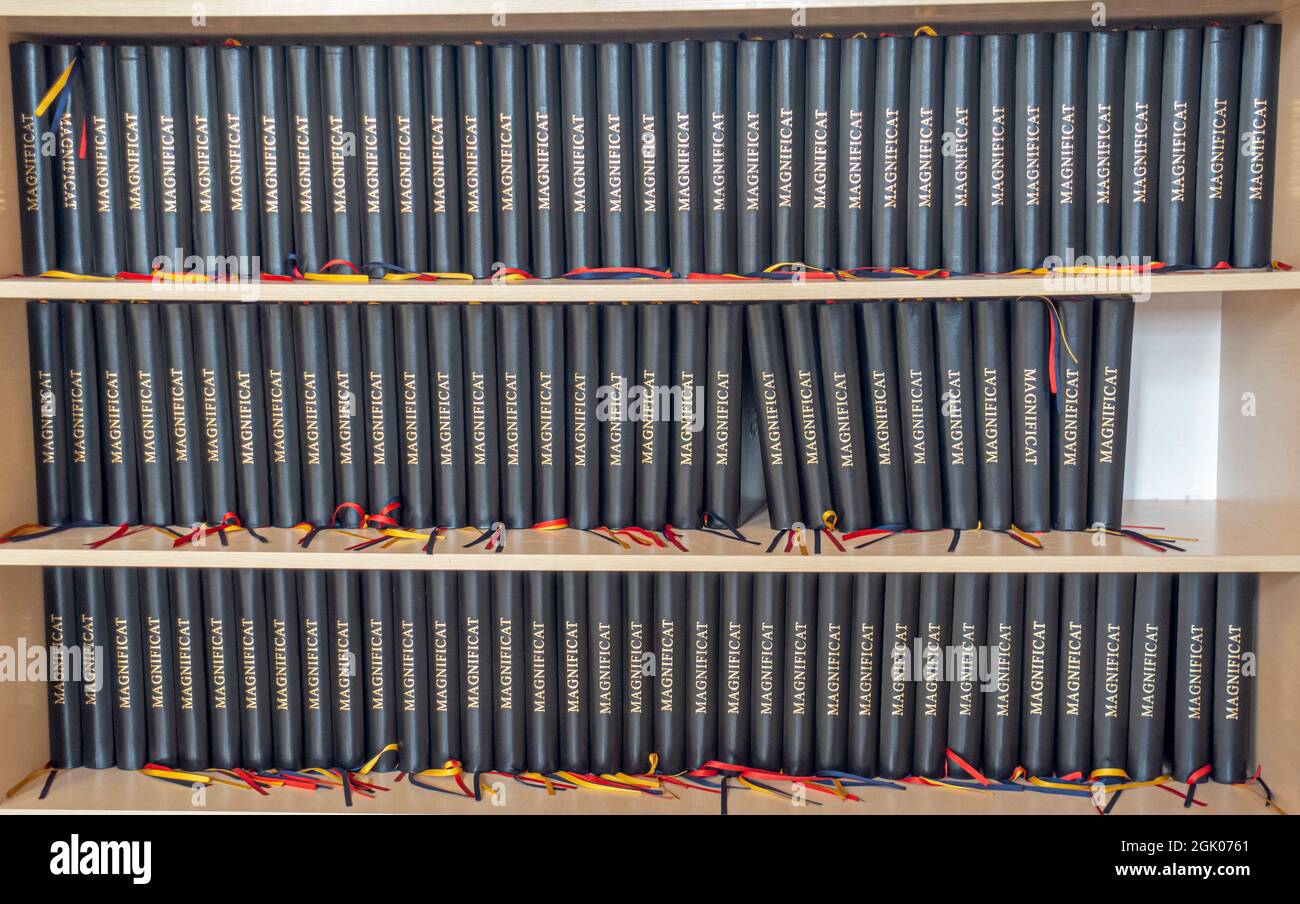 Rows of Magnificat books in the Catholic cathedral; The Magnificat is ...