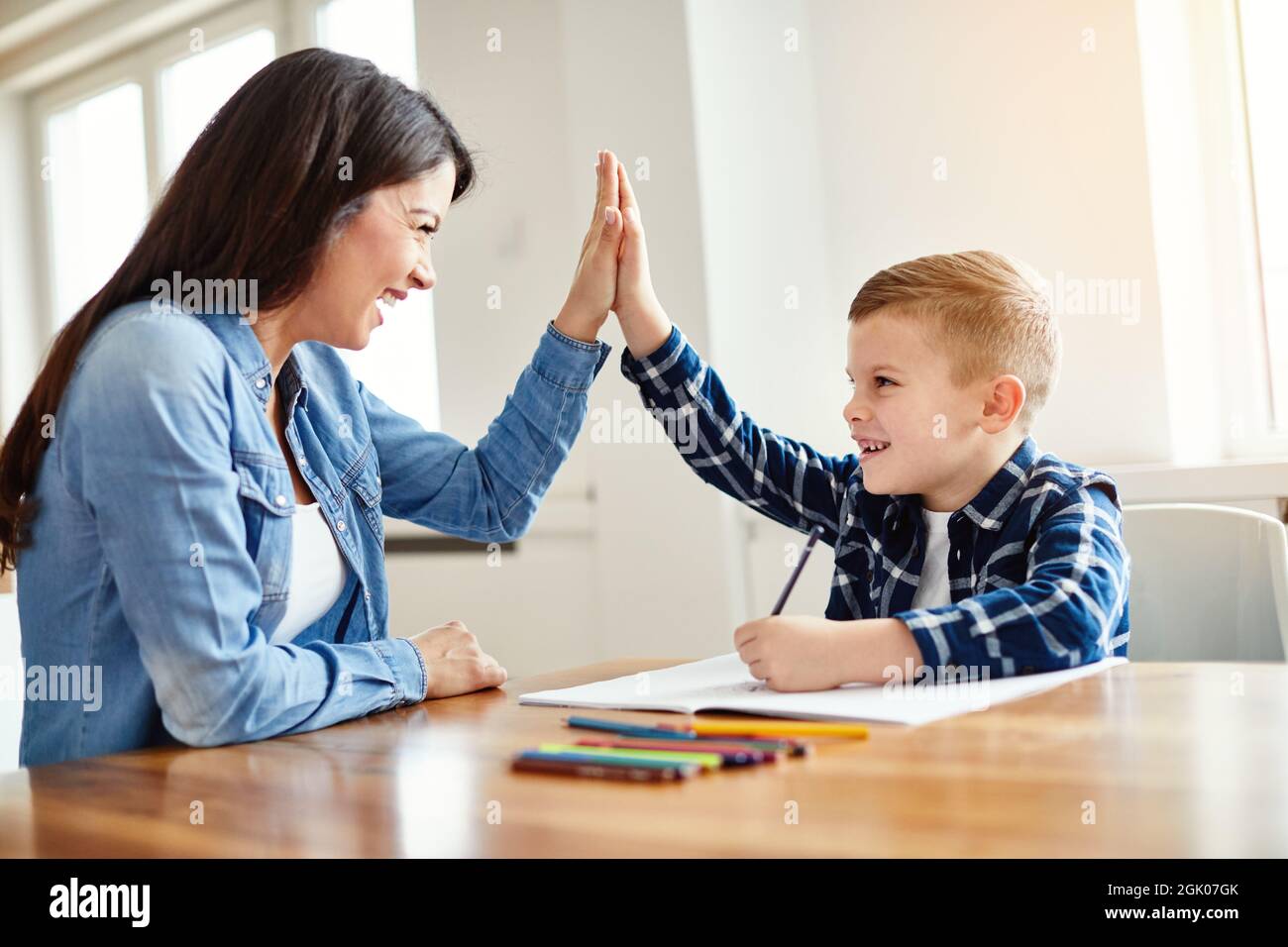 homework teaching boy high five education mother children son familiy ...