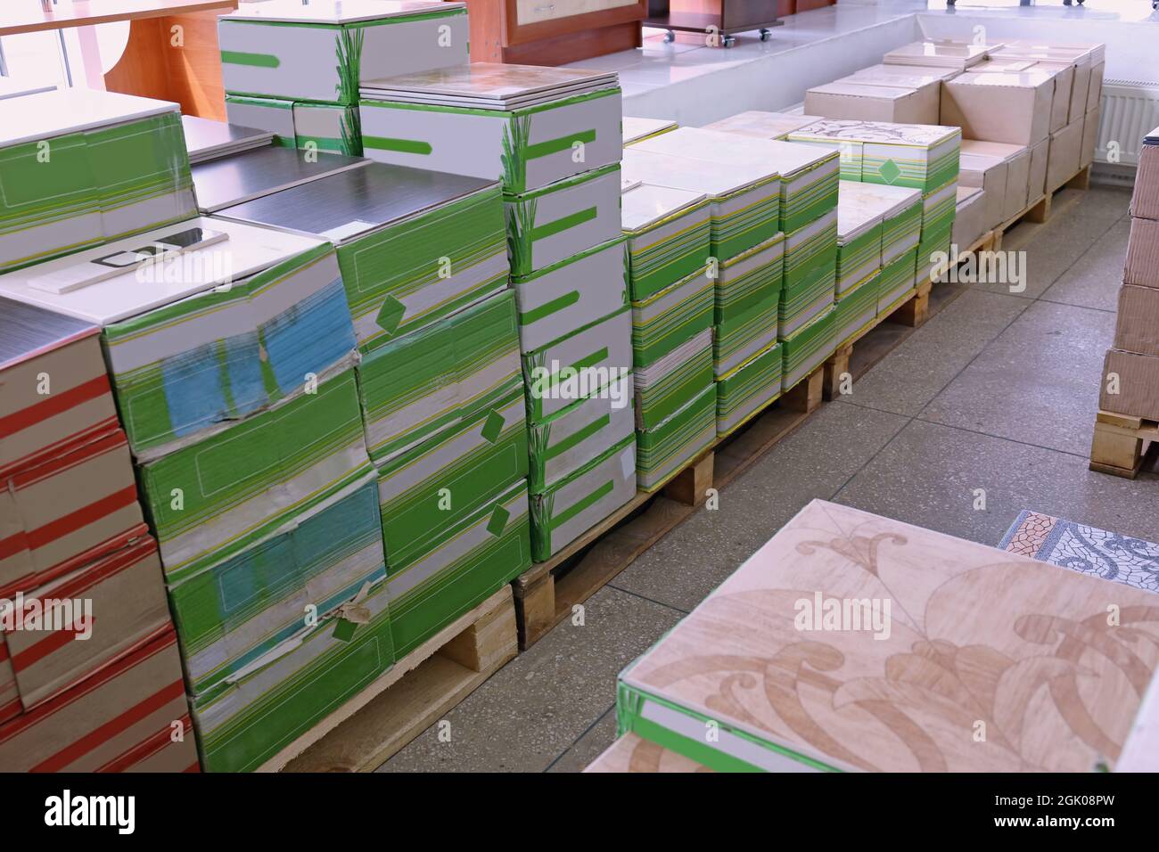 Boxes with building materials in wholesale warehouse Stock Photo - Alamy