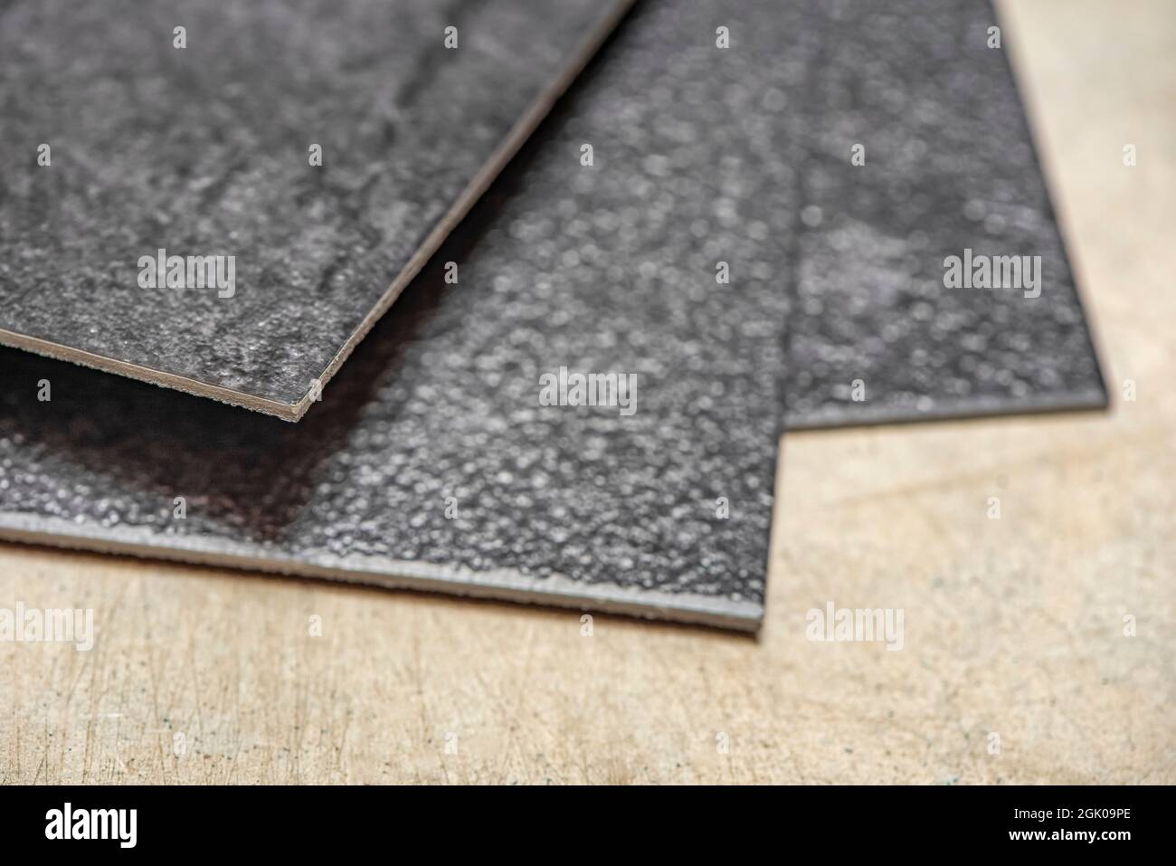 Vinyl PVC floor. The texture of the vinyl floor is black. Samples of ...