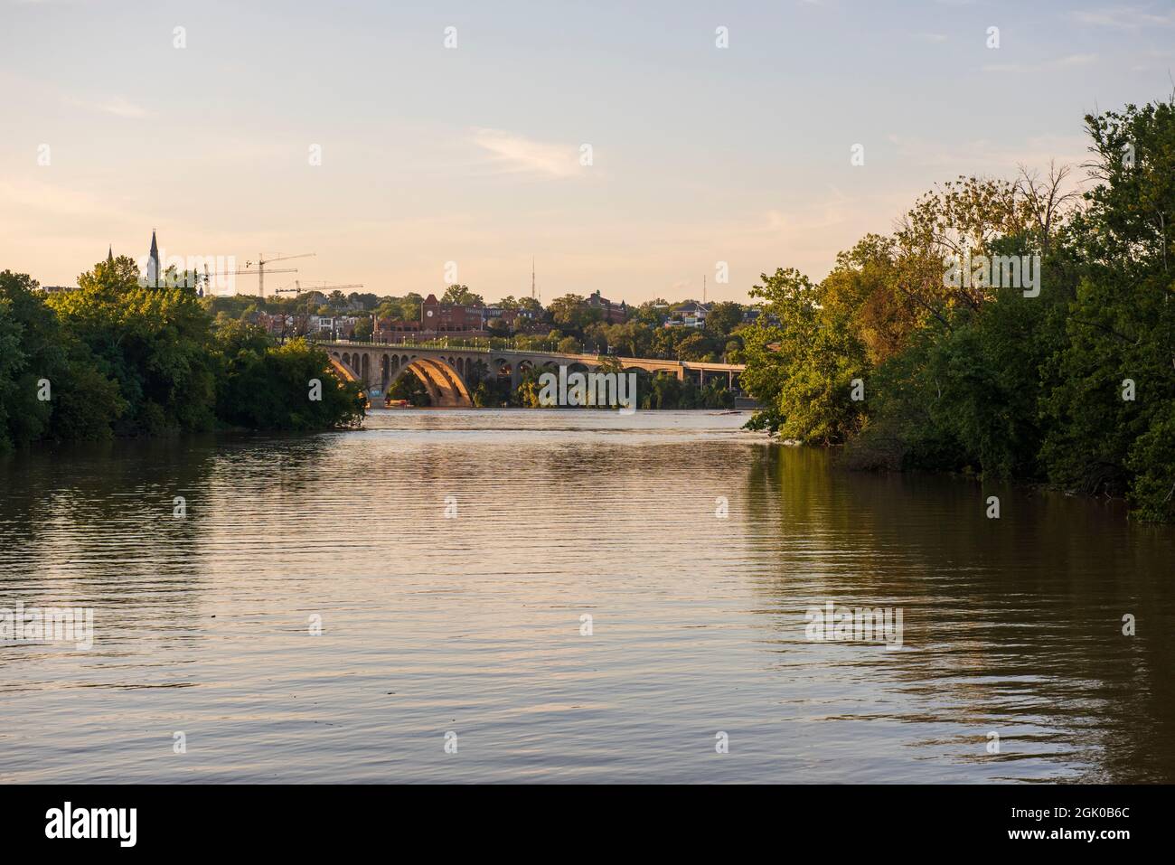View of Georgetown and Key Bridge at sunset from Roosevelt Island in ...