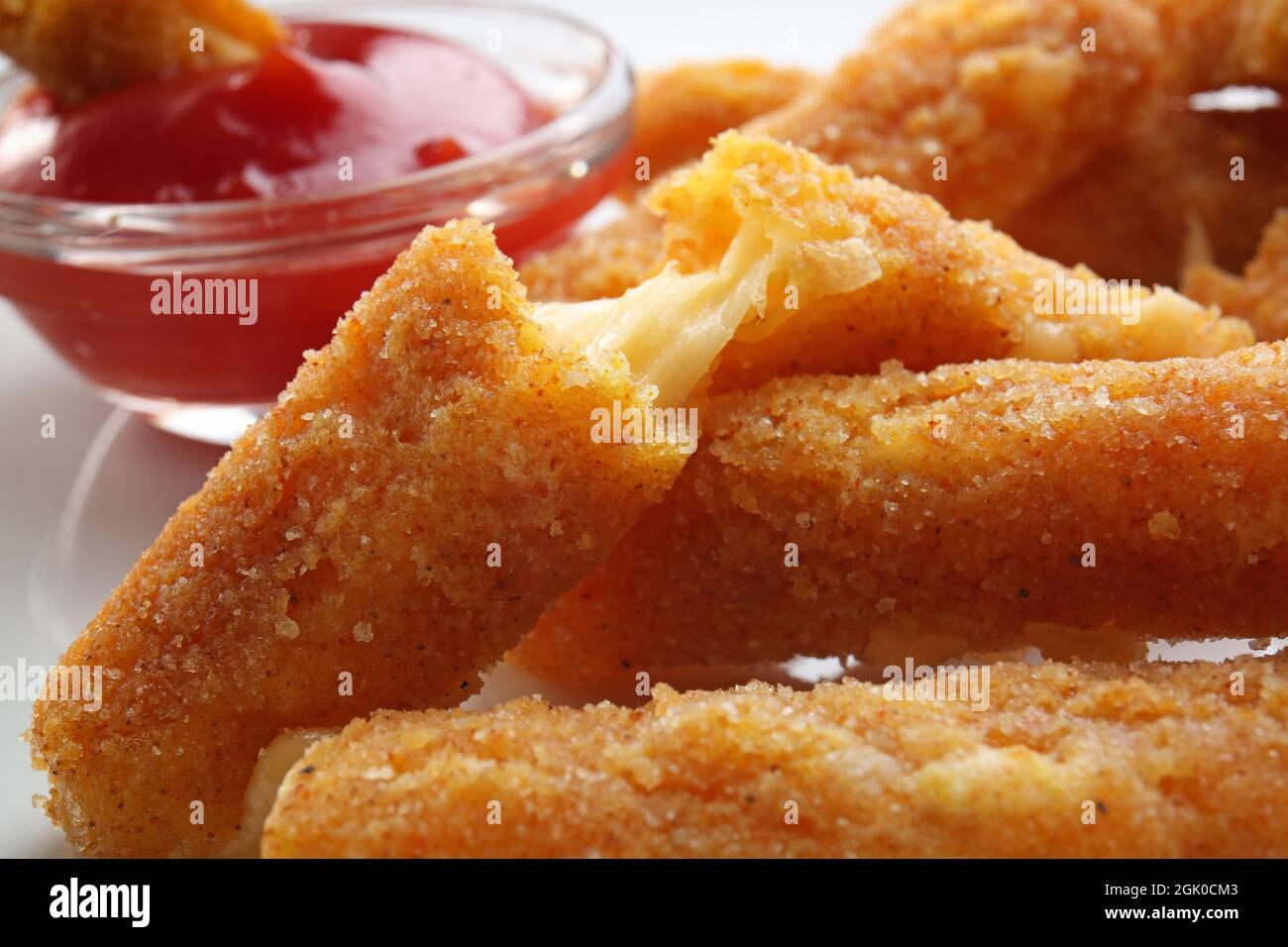 Delicious fried cheese sticks on white plate Stock Photo - Alamy