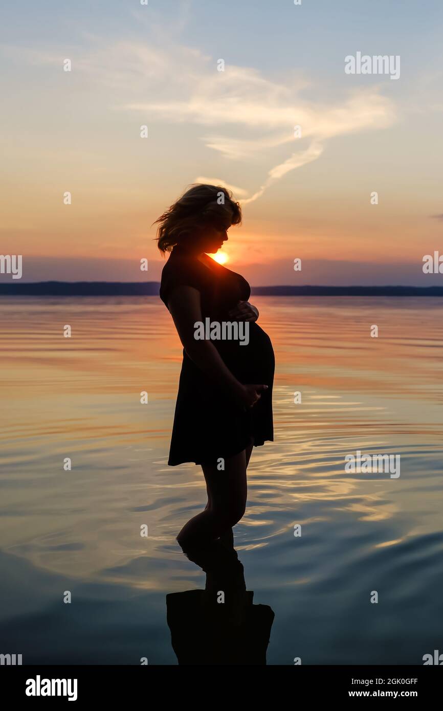 Pregnancy belly shadow hi-res stock photography and images - Alamy