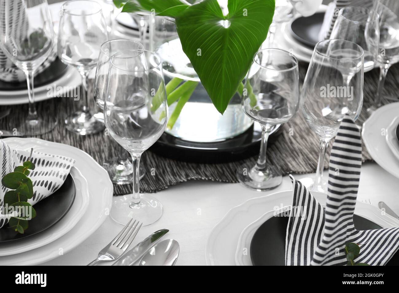 Table setting for dinner in restaurant Stock Photo - Alamy