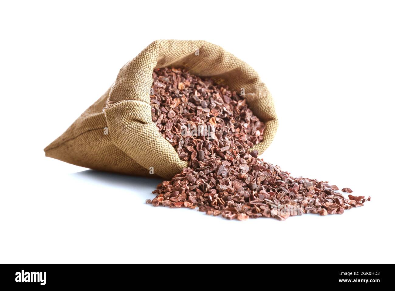 Textile sack with cocoa nibs on white background Stock Photo - Alamy