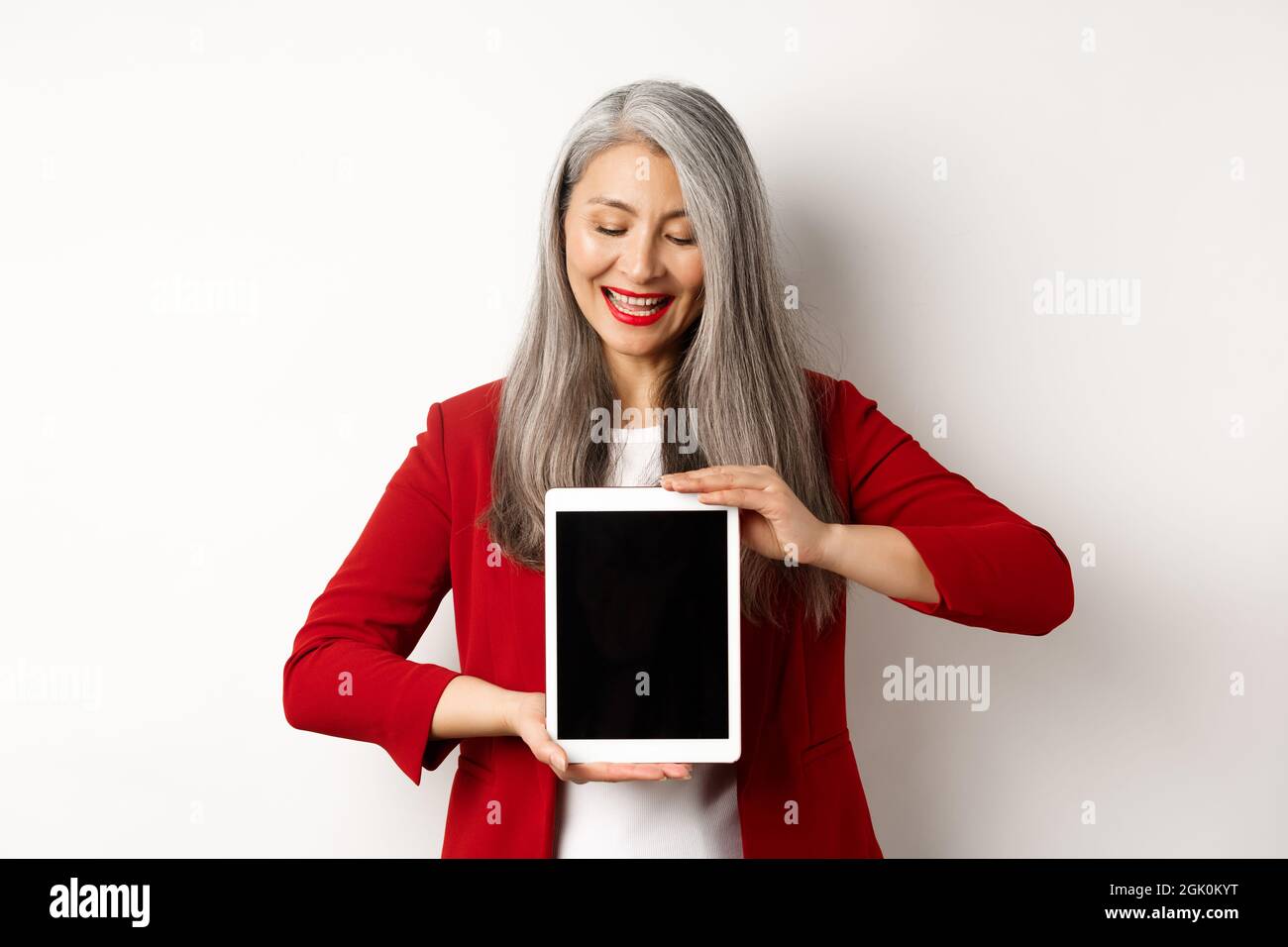 Business. Successful asian businesswoman in red blazer showing blank ...
