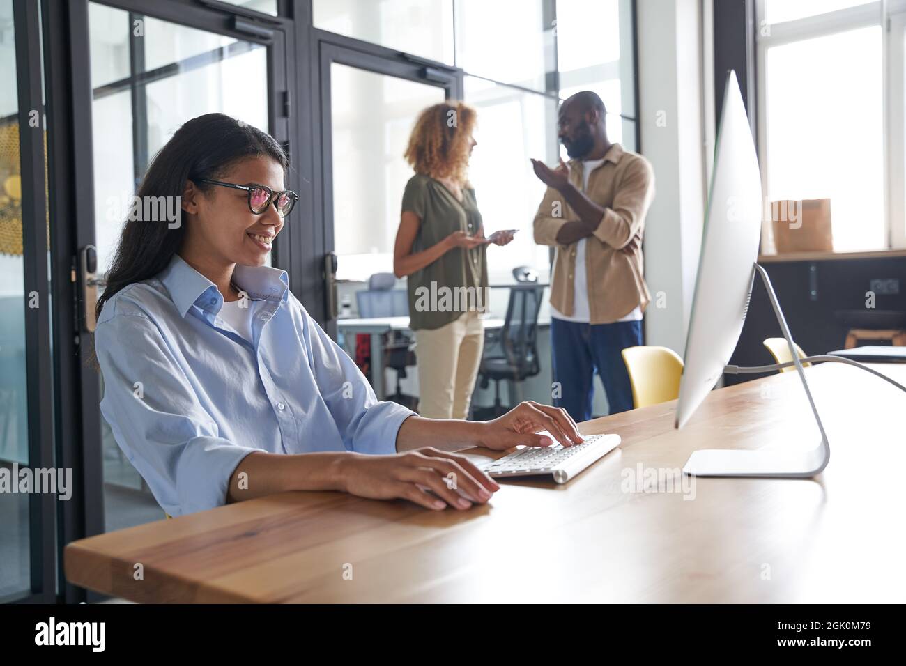 Employee speaking with customer via social network Stock Photo - Alamy