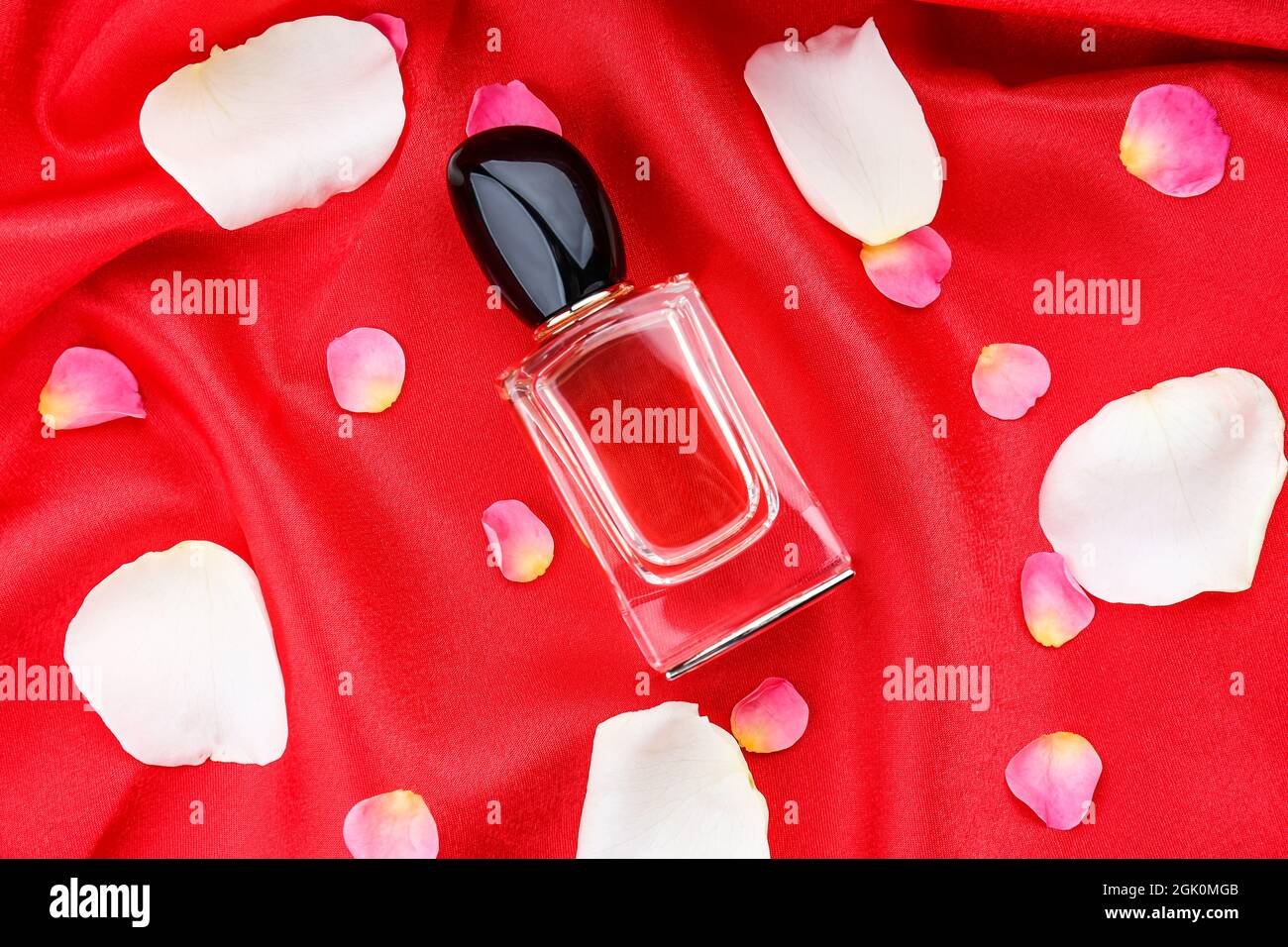 Perfume bottle on cloth Stock Photo - Alamy