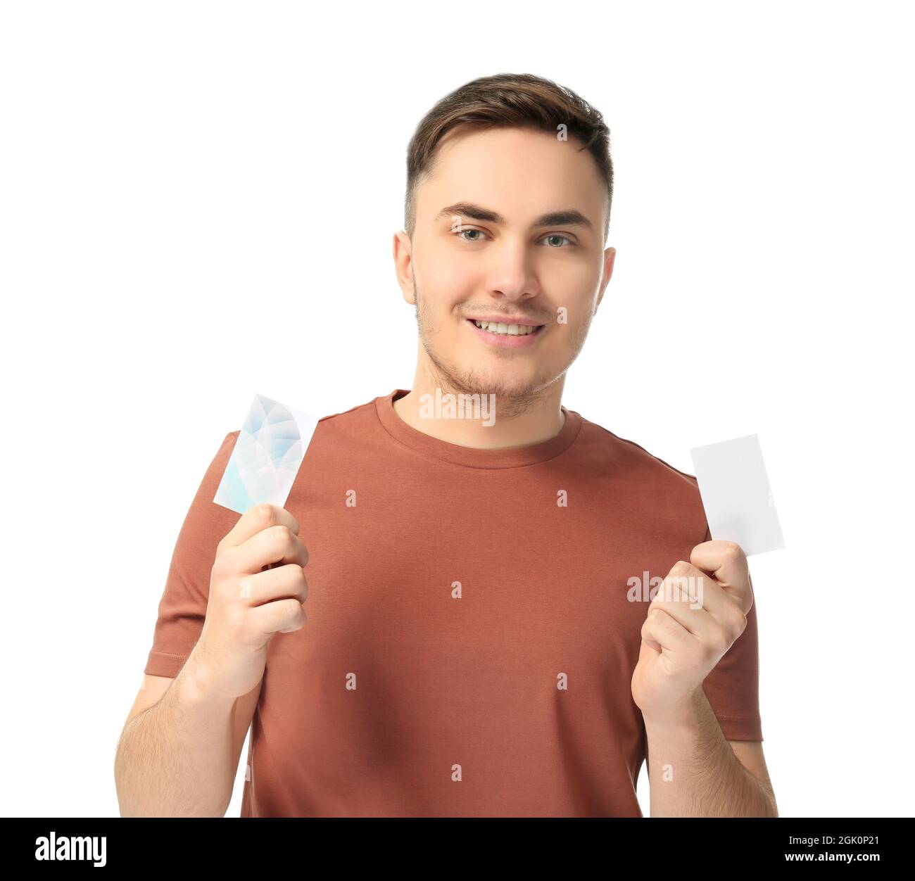 Handsome young man with business cards on white background Stock Photo ...