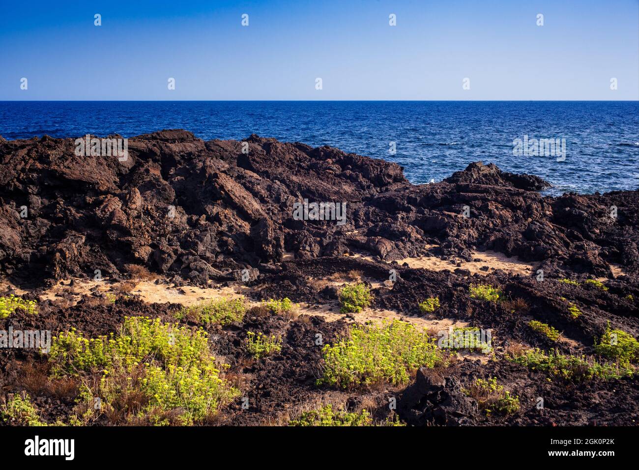 View of the scenic lava rock cliff in the Linosa island. Sicily Stock ...