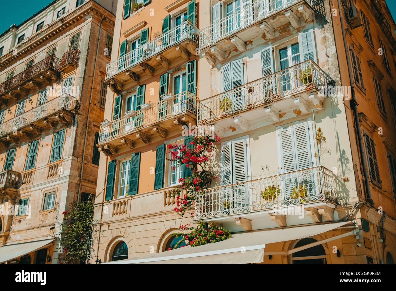 Beautiful apartment building in Italian city. Windows with shutters ...
