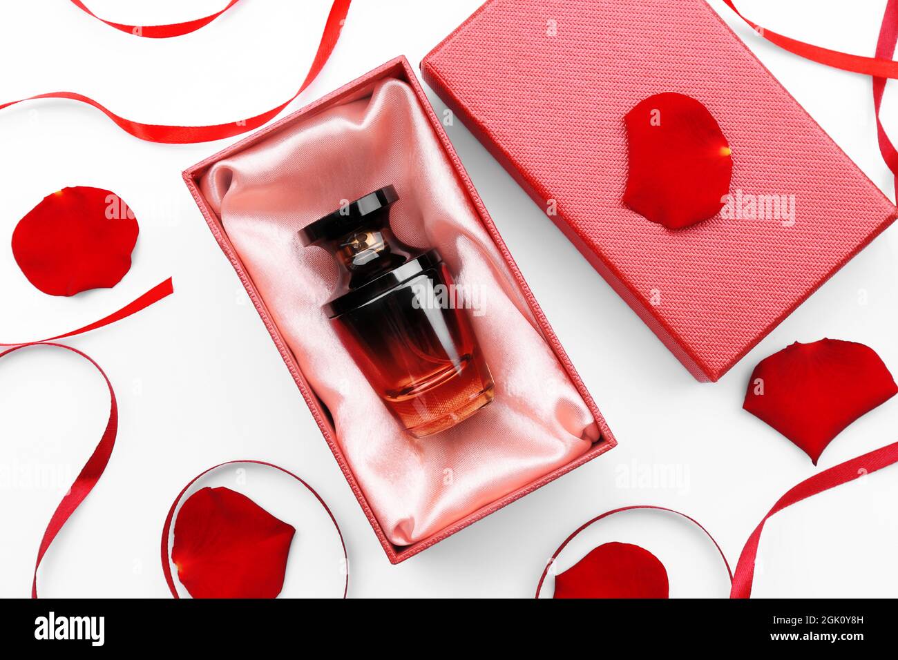 Perfume in present box on white background Stock Photo - Alamy