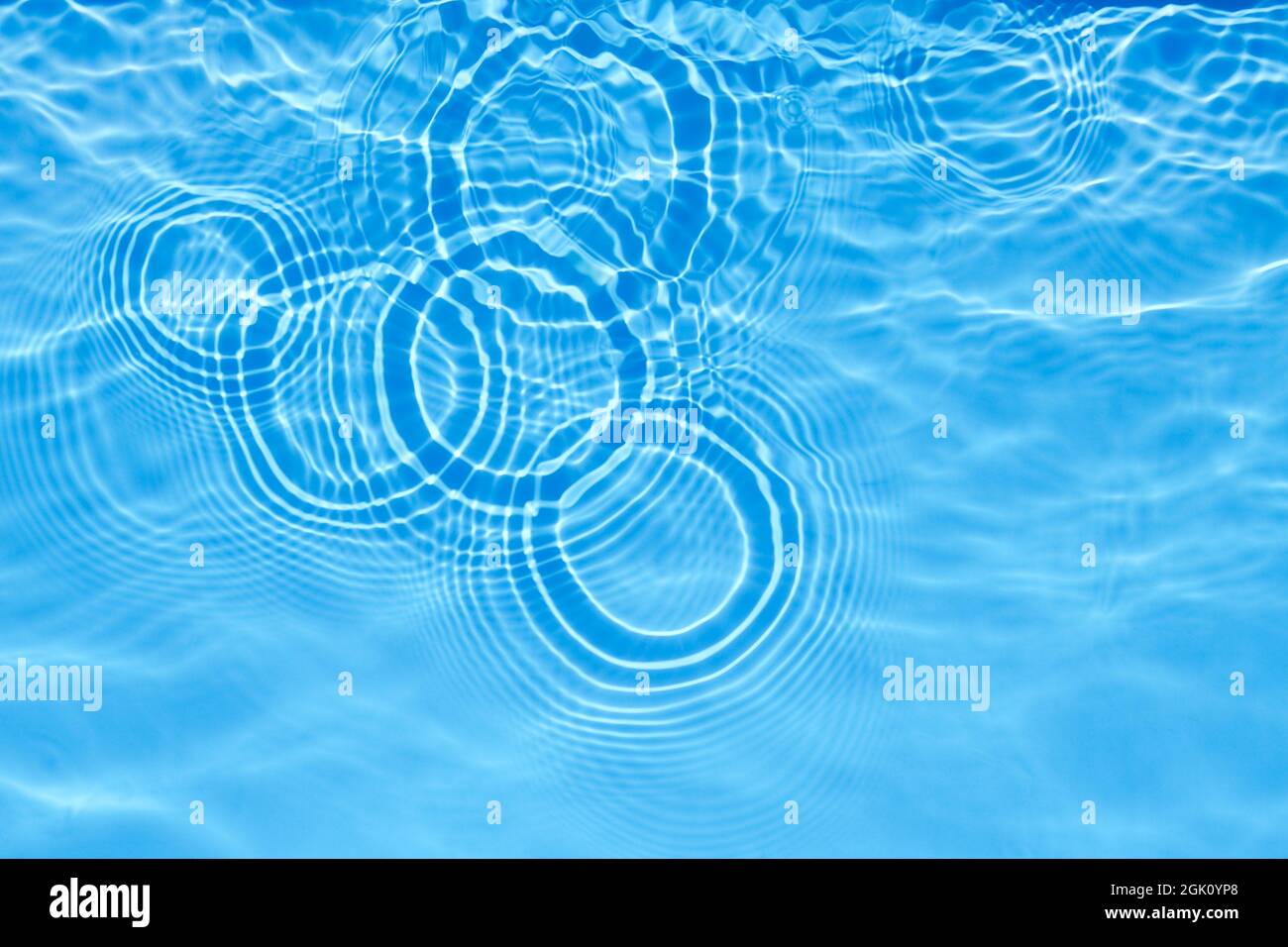 Surface of light blue transparent swimming pool water texture with ...