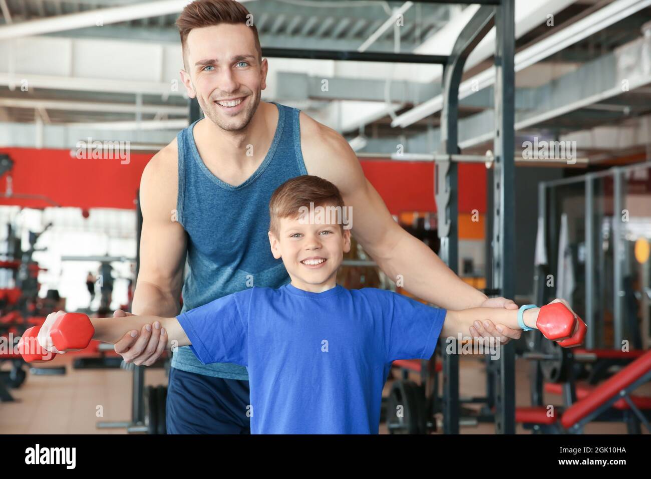 Dad and son training in gym Stock Photo - Alamy