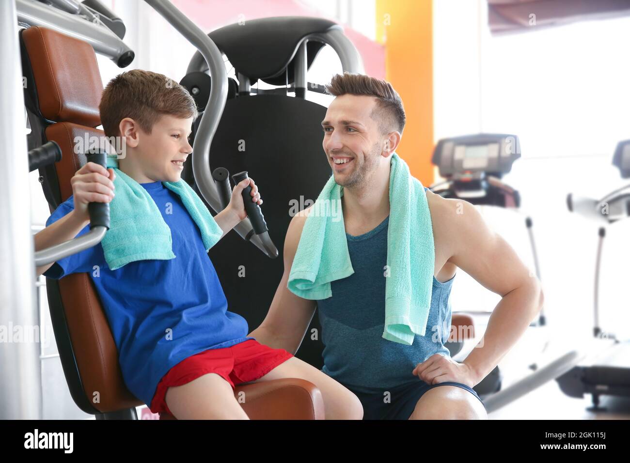 Dad and son training in gym Stock Photo - Alamy