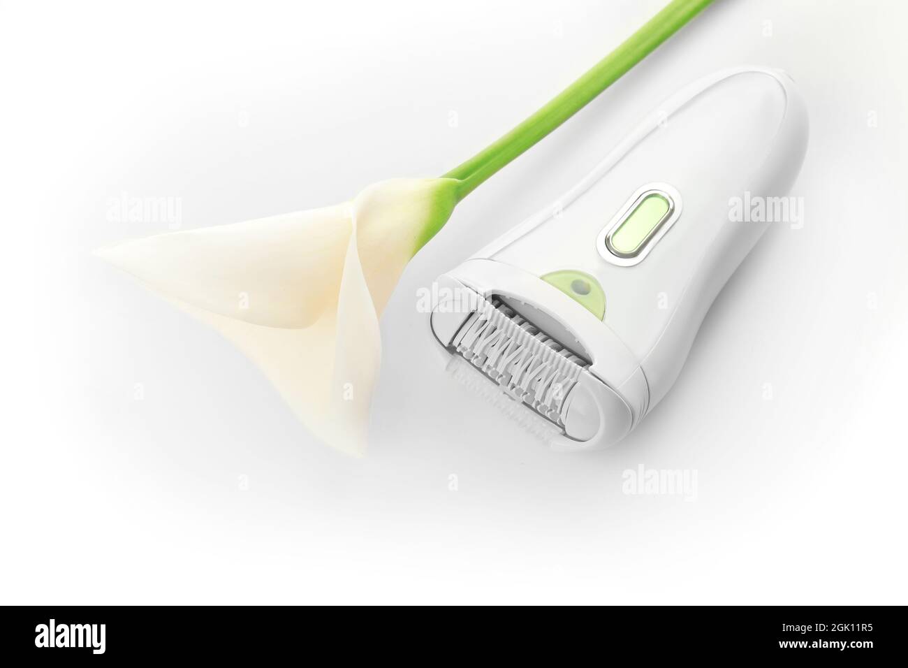 Modern epilator and flower on white background Stock Photo - Alamy