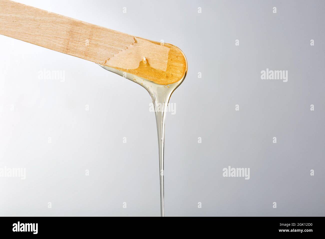 Wooden stick with sugaring paste on light background Stock Photo - Alamy Wooden stick with sugaring paste on light background Stock Photo - Alamy