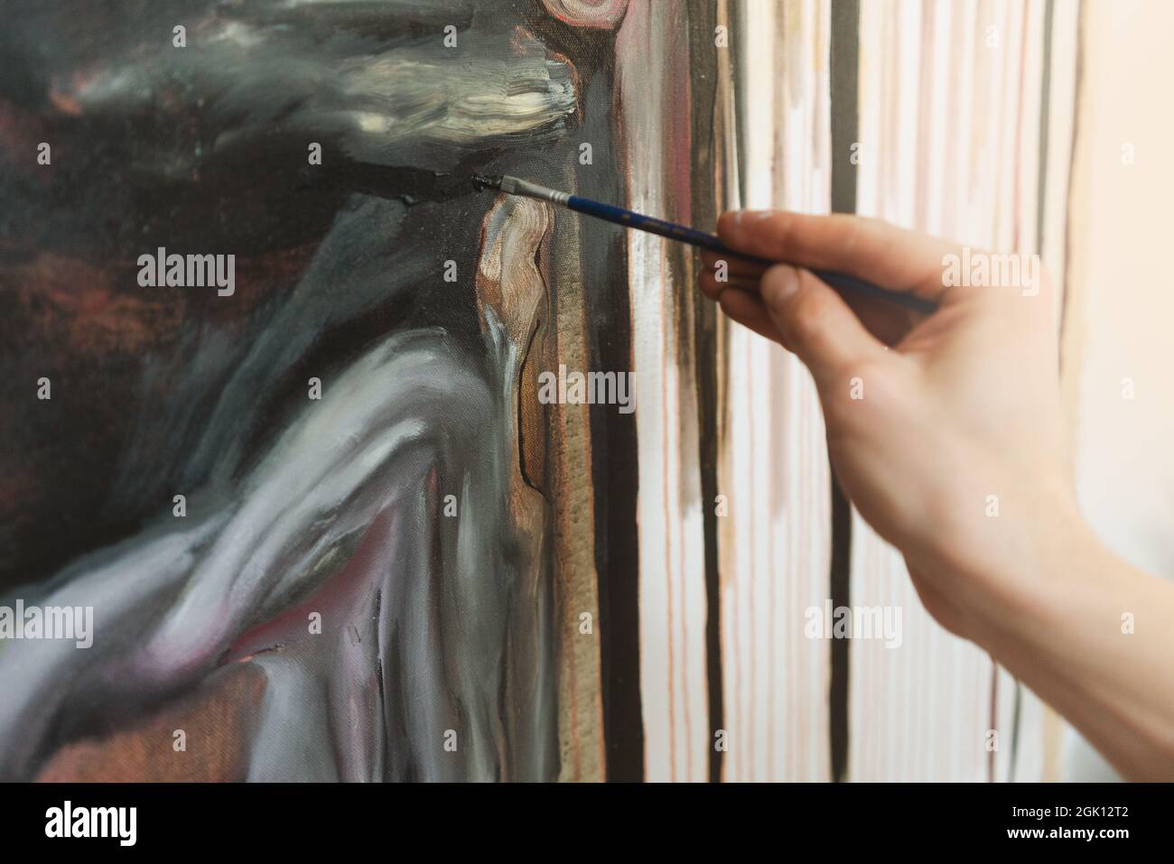 Artists hand draw painting on board Stock Photo - Alamy