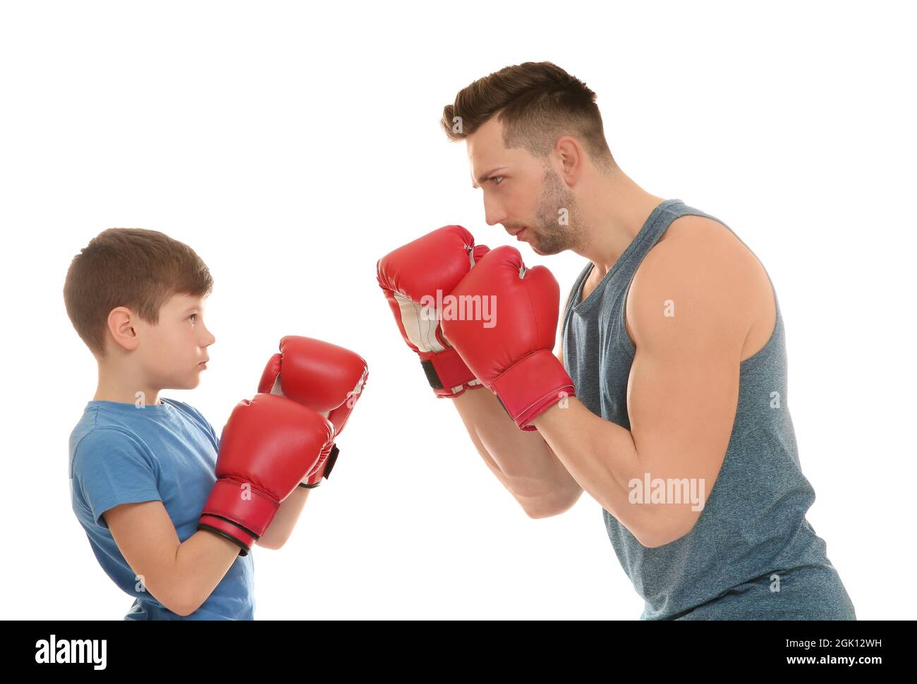 Dad and son in boxing gloves on white background Stock Photo - Alamy