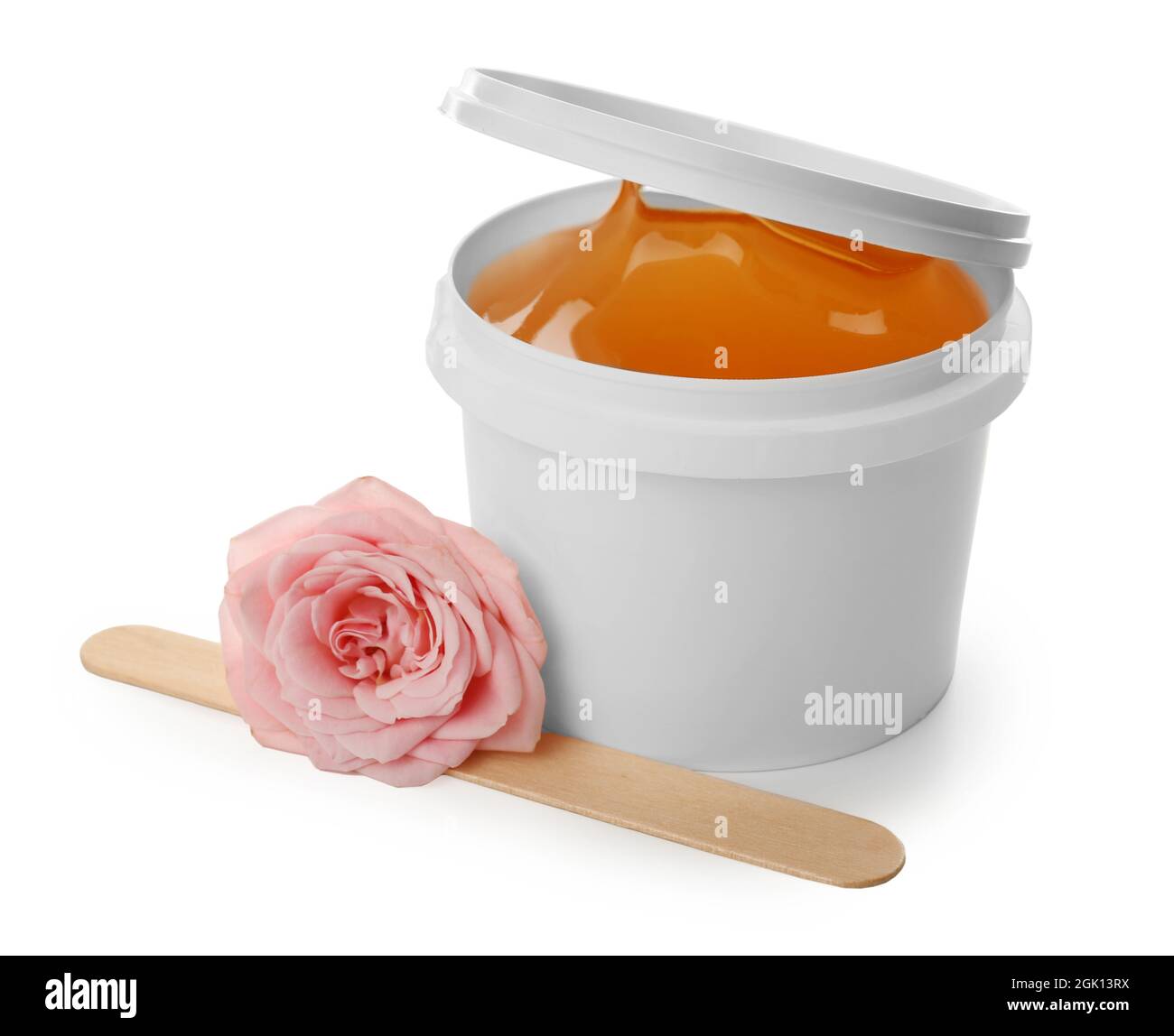 Plastic bucket with sugaring paste, stick and flower on white ...