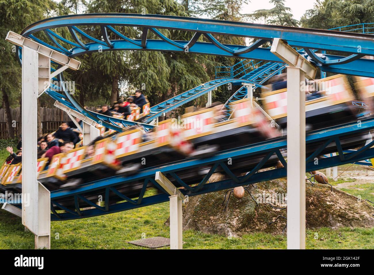 View of a wagon moving fast on the tracks of a roller coaster at an amusement park Stock Photo ...