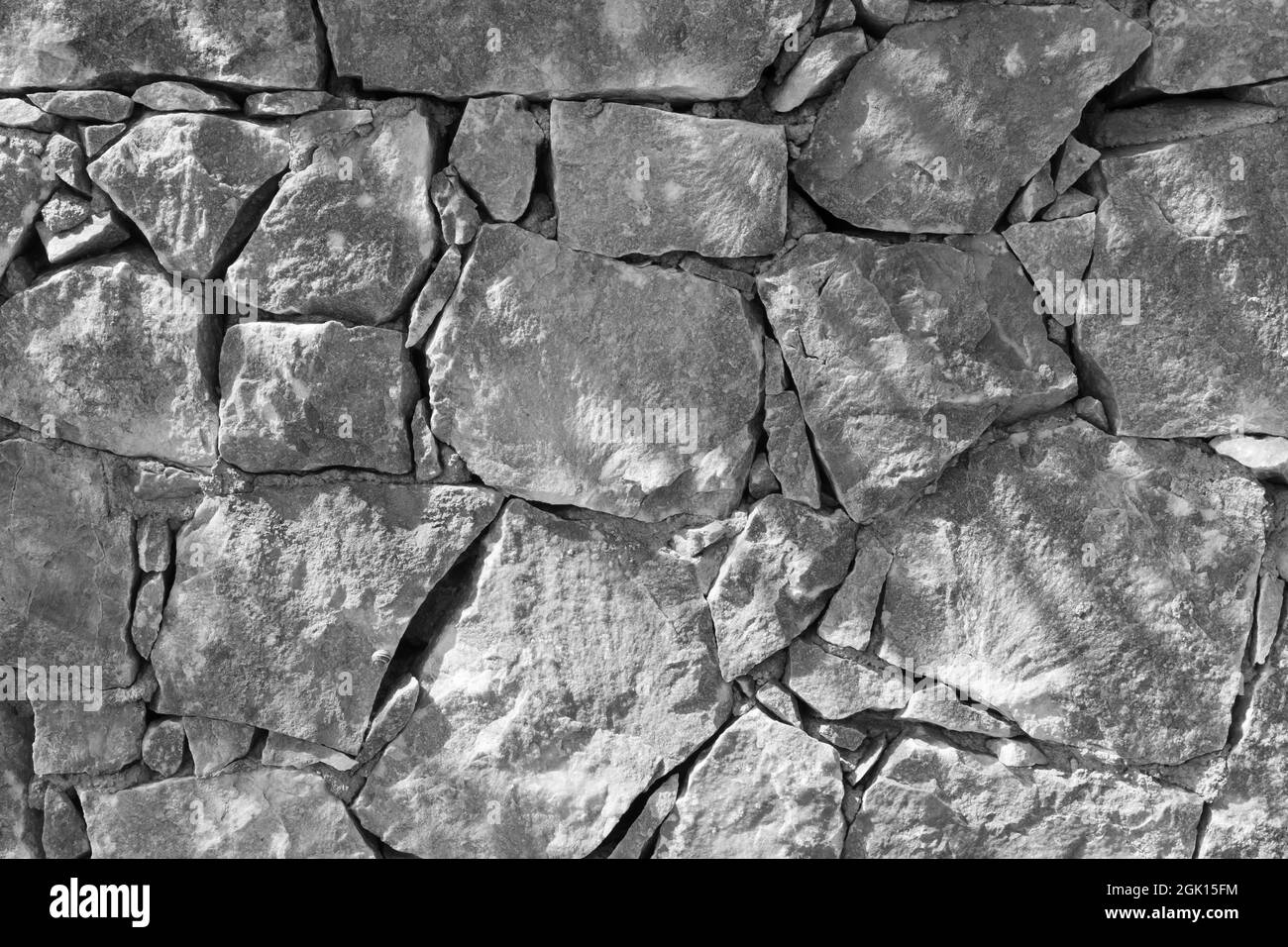 A natural stone wall texture background Stock Photo - Alamy