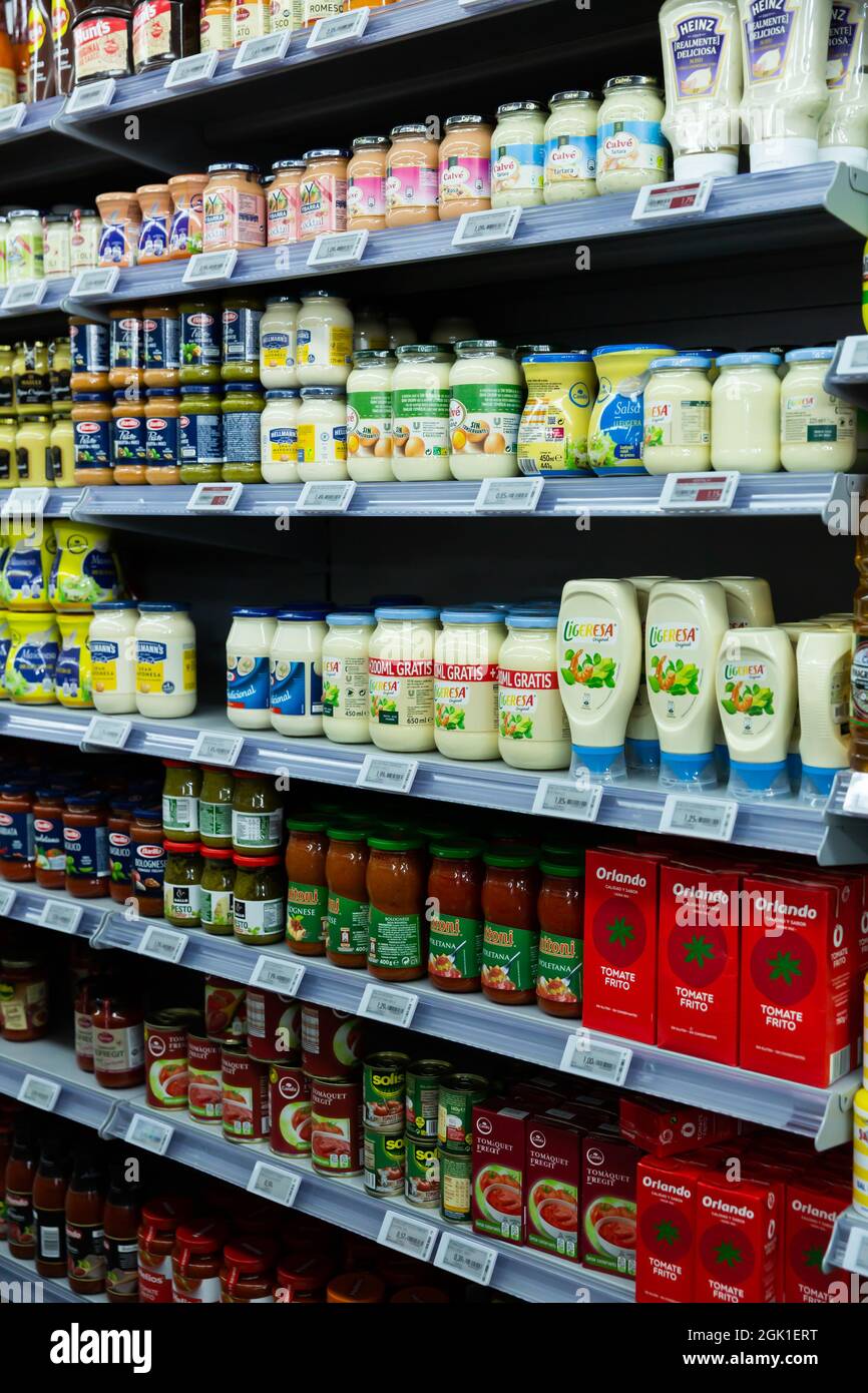 Various sauces and spices on shelves in supermarket Stock Photo - Alamy