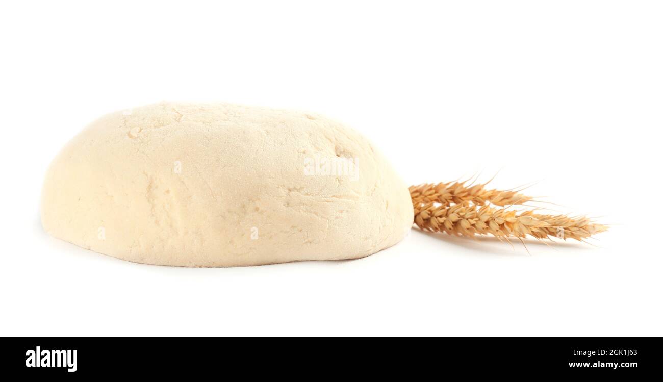 Fresh raw dough and wheat on white background Stock Photo - Alamy