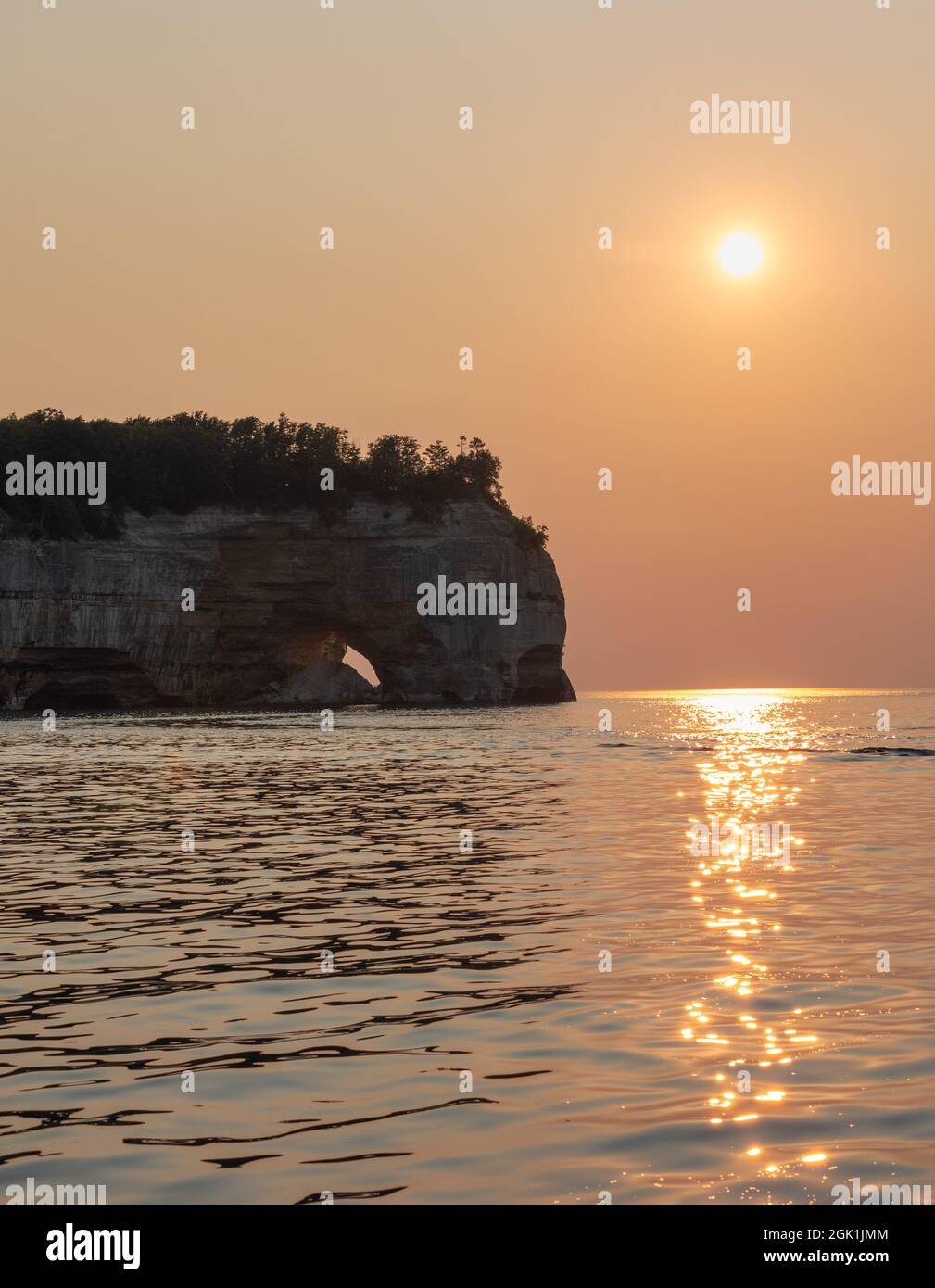 Sunset over natural arch along Pictured Rocks National Lakeshore Stock ...