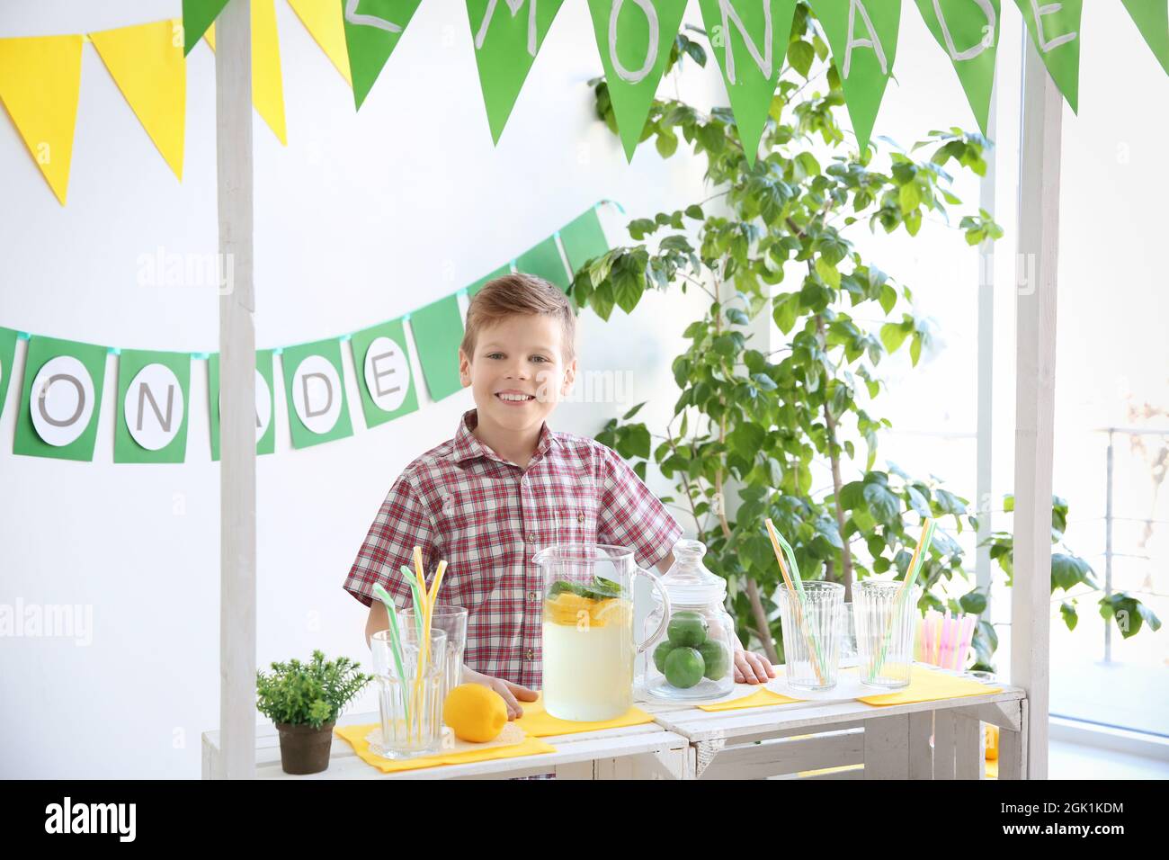 Cute little boy selling lemonade at counter Stock Photo - Alamy