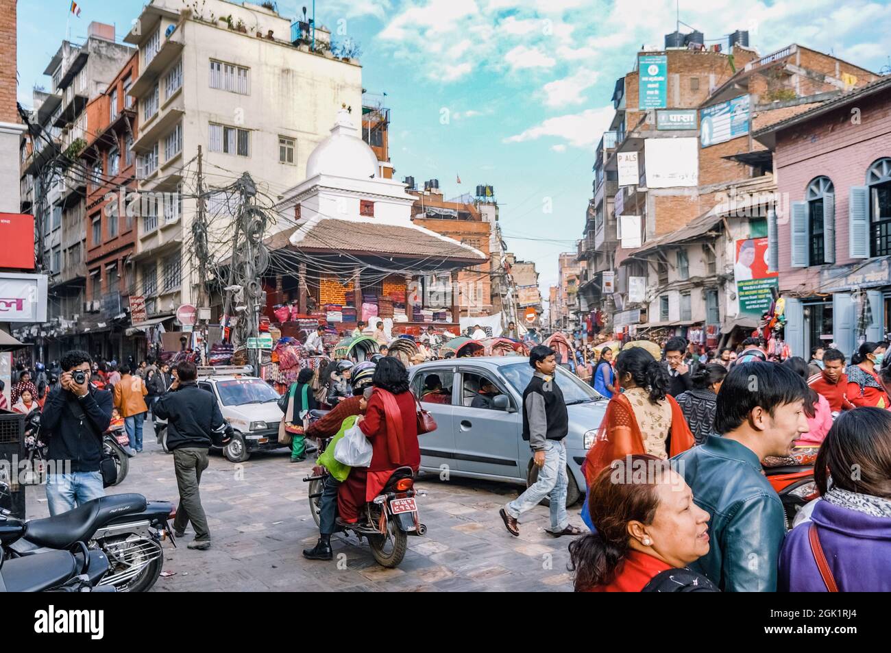 Bikes, pedestrians and cars: busy traffic at Indra Chok square in ...