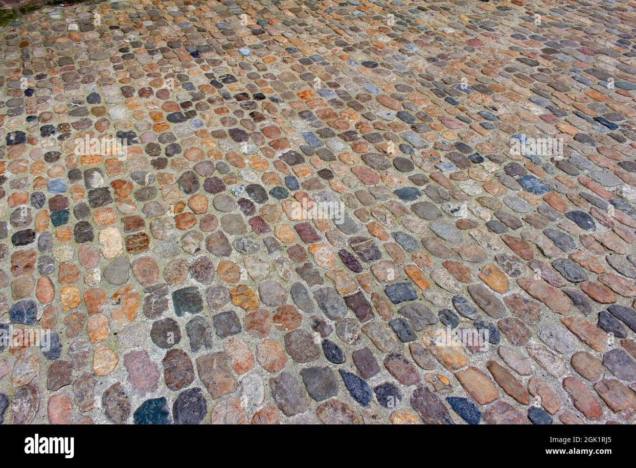 Close-up texture background view of a vintage cobblestone surface on a ...