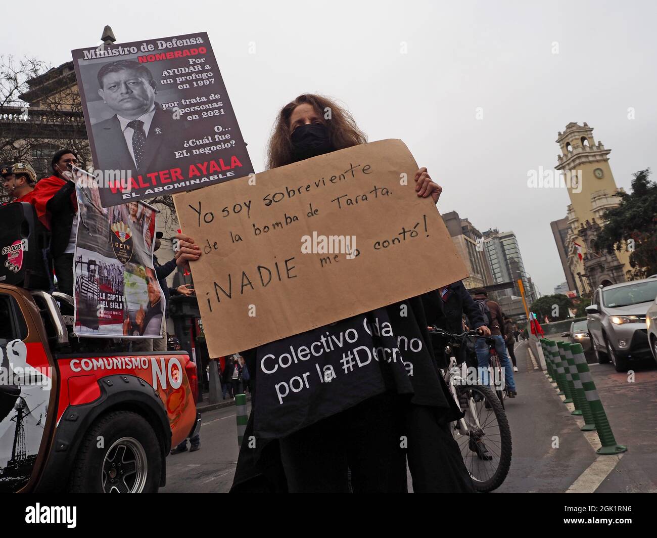 Survivor woman of the Tarata street bombing carrying a sign when ...