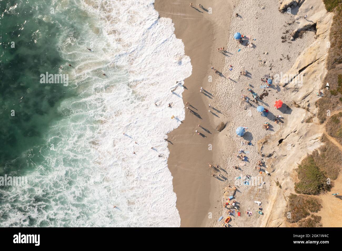 Top Down drone view of people on beach Stock Photo - Alamy