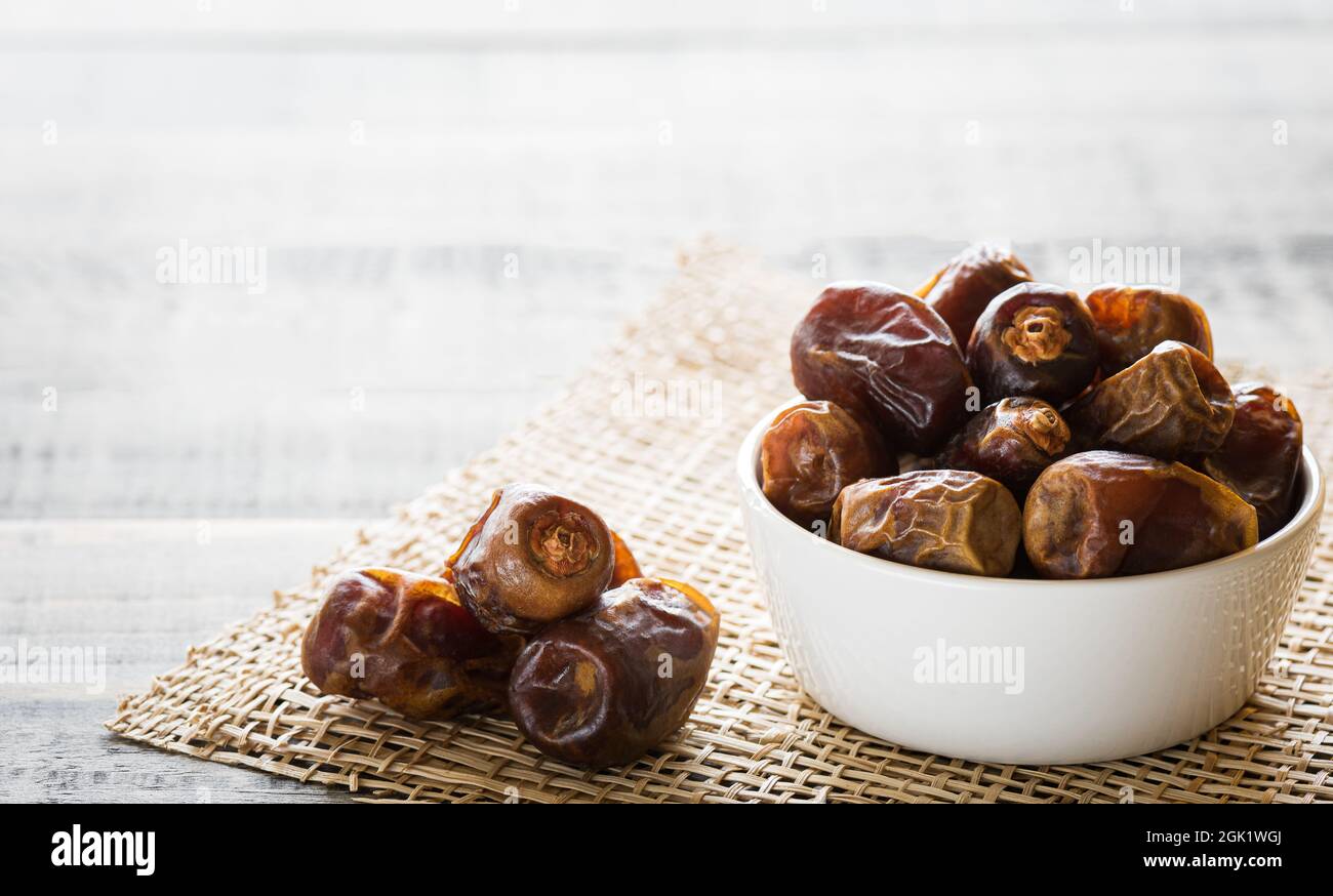 Dates fruit on dark wooden background. Muslim simple Iftar concept ...