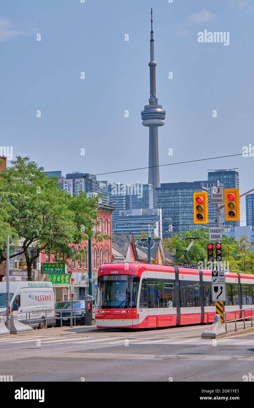 Photograph of Spadina Avenue including a streetcar and the CN tower in ...