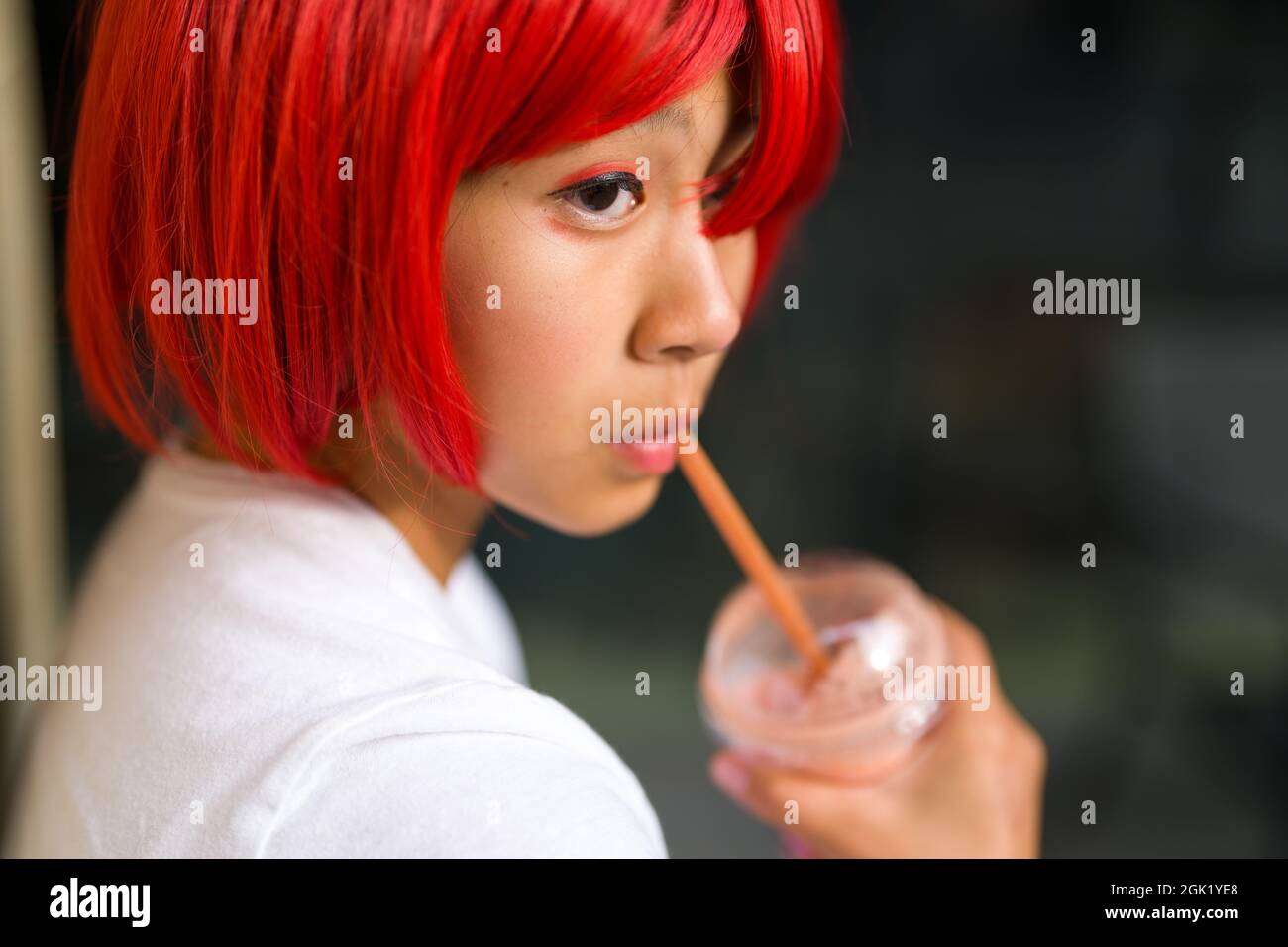 Closeup of Teenage Asian Cosplay Actress Drinking a Smoothie | Teenage ...