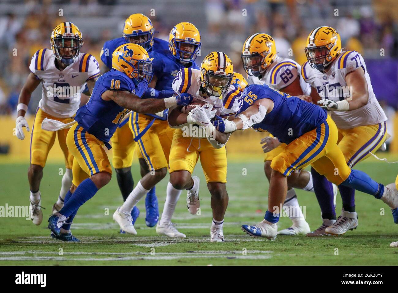 September 11, 2021: LSU running back Corey Kiner (21) carries several ...