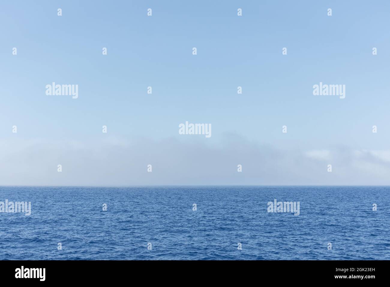 Horizon view of the great blue ocean from close under the clear and ...