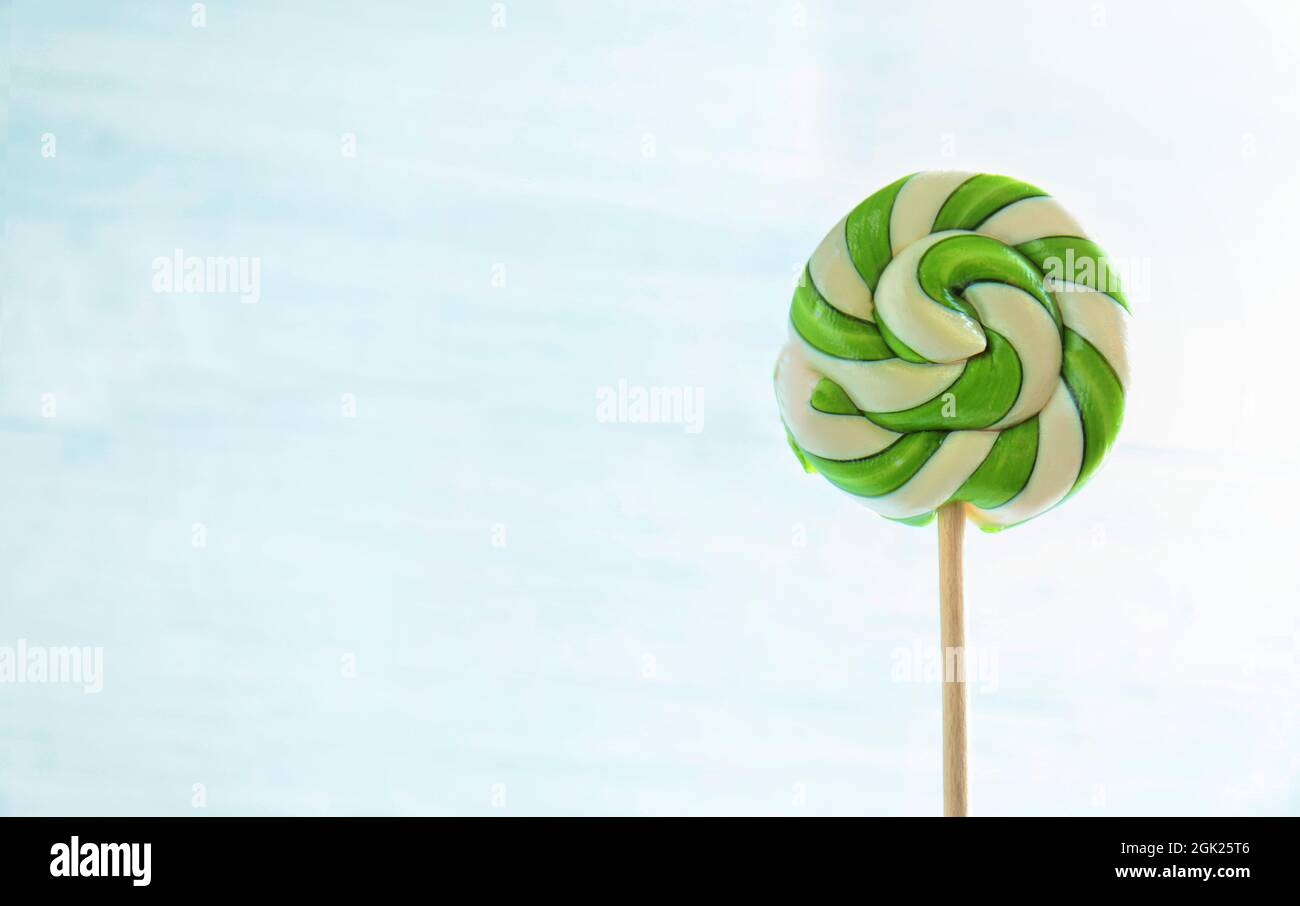 White-green lollipop on white background Stock Photo - Alamy