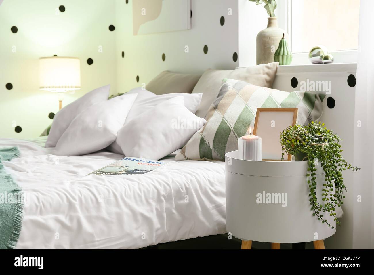 Stylish interior of modern bedroom with bedside table Stock Photo - Alamy