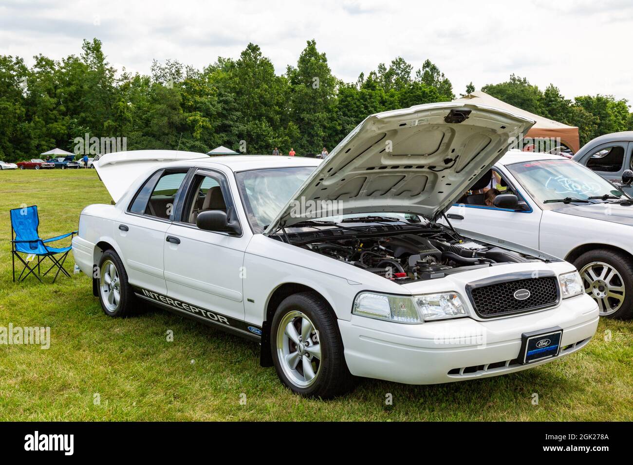 A white Ford Crown Victoria Police Interceptor sedan on display at a ...