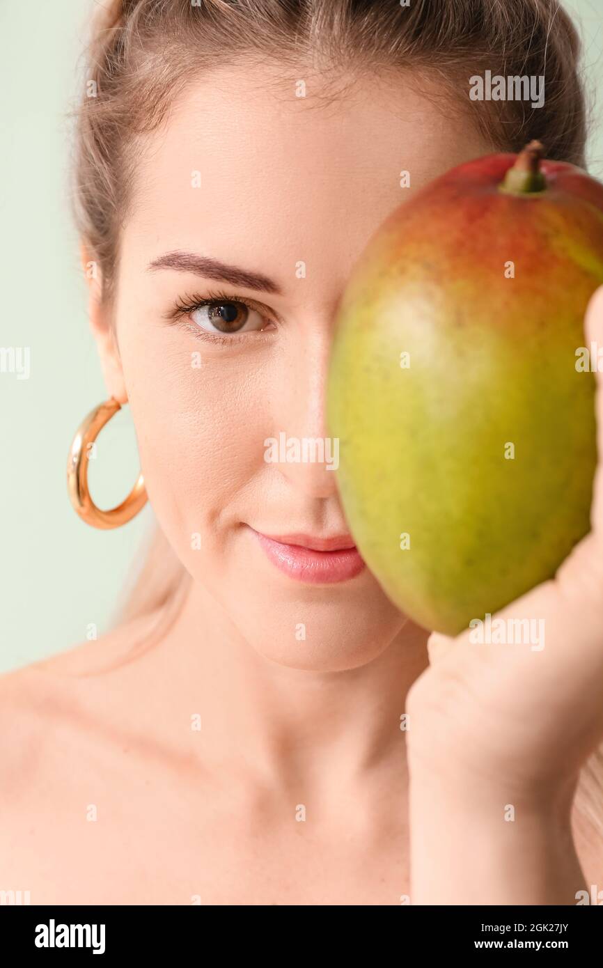 Young woman eating mango model hi-res stock photography and images - Alamy