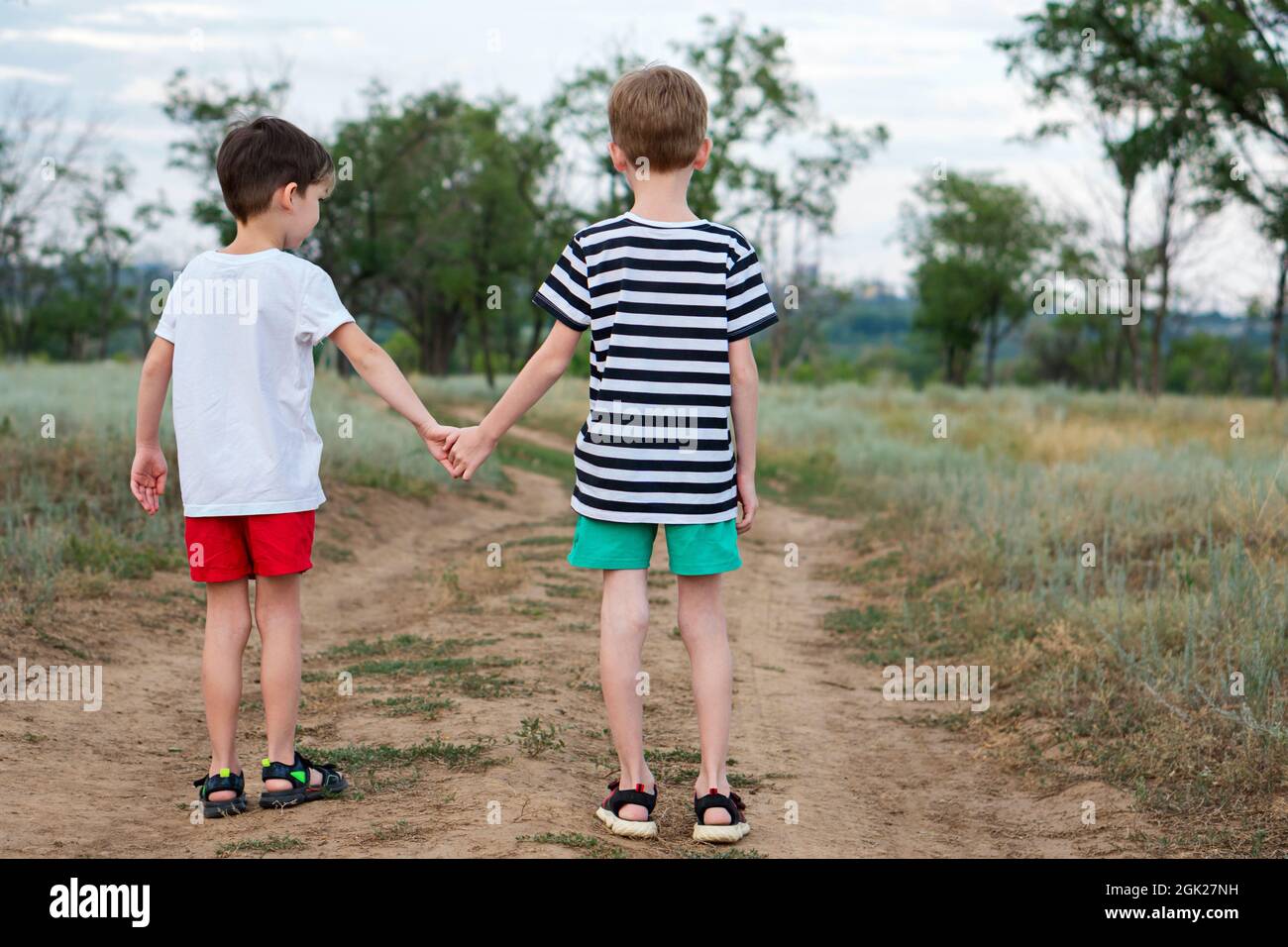 Two Boy Friends Holding Hands