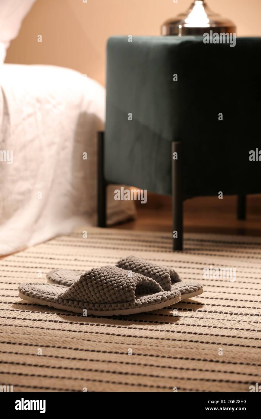 Female slippers on rug at home Stock Photo - Alamy