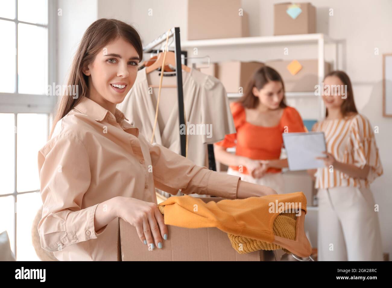 Female sellers in warehouse store Stock Photo - Alamy