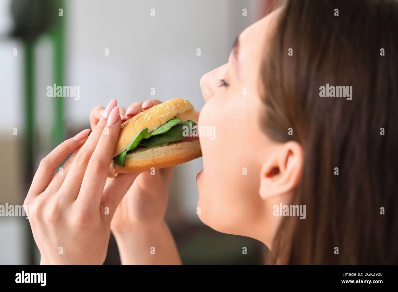 Woman eating veggie sandwich hi-res stock photography and images - Alamy